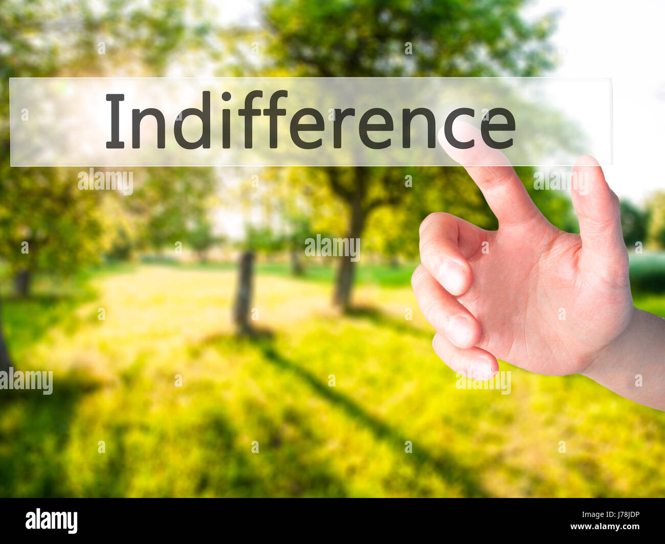 Indifference - Hand pressing a button on blurred background concept ...