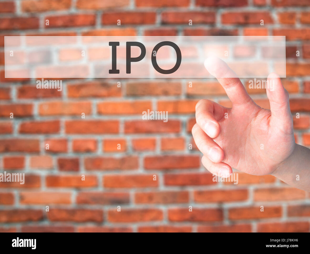 IPO - Hand pressing a button on blurred background concept . Business ...