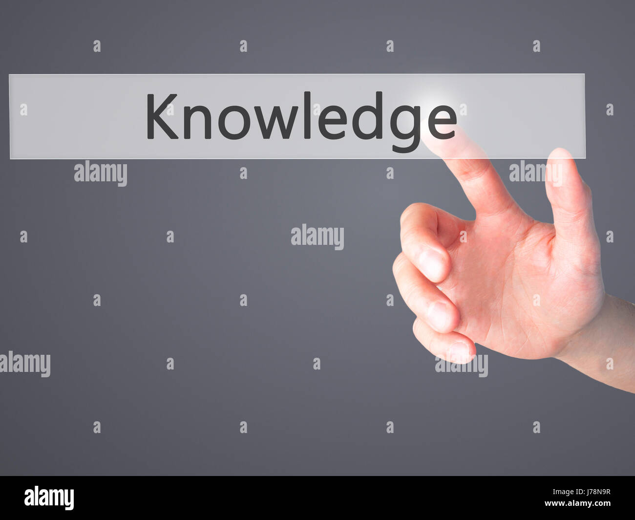 Knowledge - Hand pressing a button on blurred background concept ...