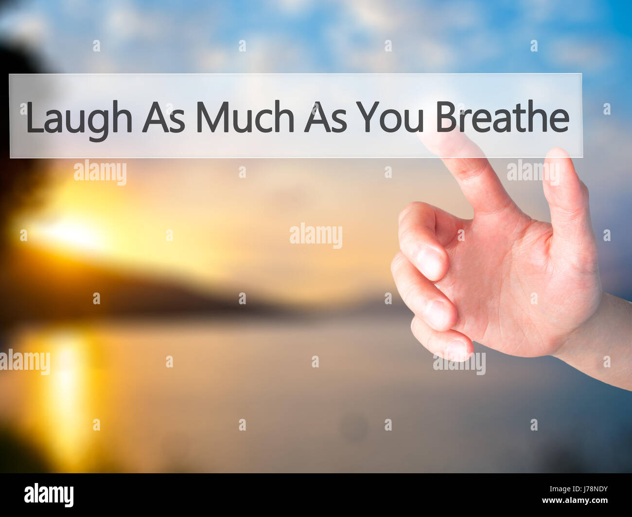 Laugh As Much As You Breathe - Hand pressing a button on blurred ...