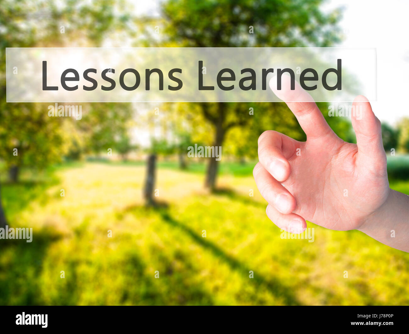 Lessons Learned - Hand pressing a button on blurred background concept ...