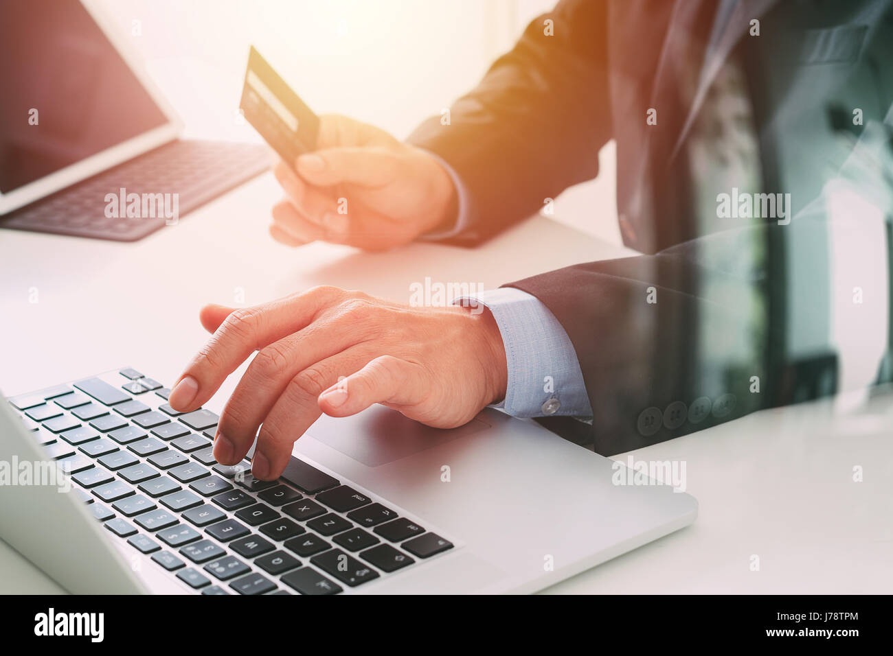 Businessman making online payment holding hi-res stock photography and ...