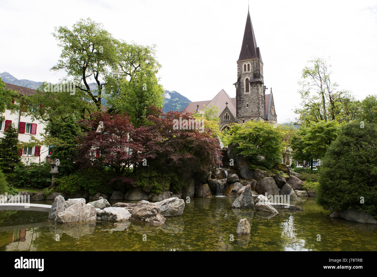 An ornamental Japanese garden at Interlaken in Switzerland. The spire ...