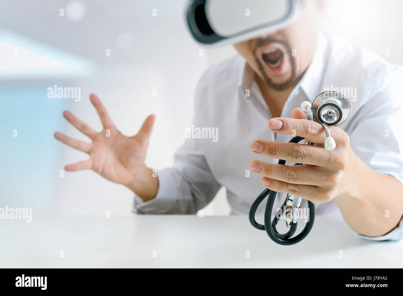 smart doctor wearing virtual reality goggles in modern office with ...