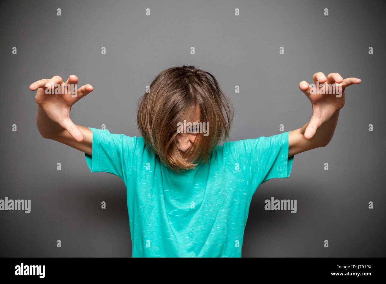 portrait of scary boy with long hair, close up Stock Photo - Alamy