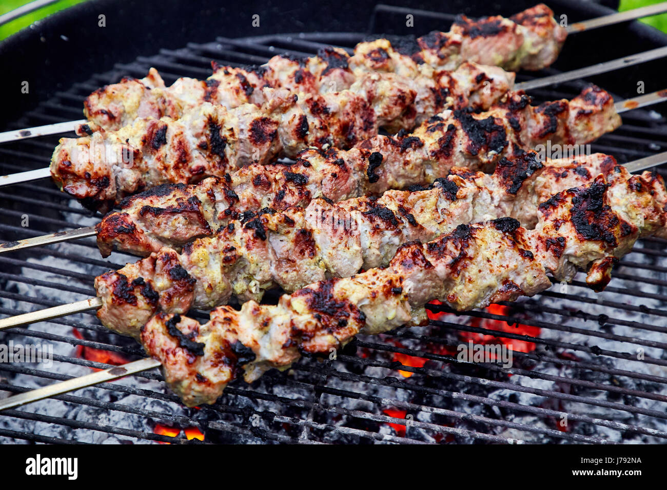 Barbecue skewers meat kebabs on a grill, selective focus Stock Photo ...