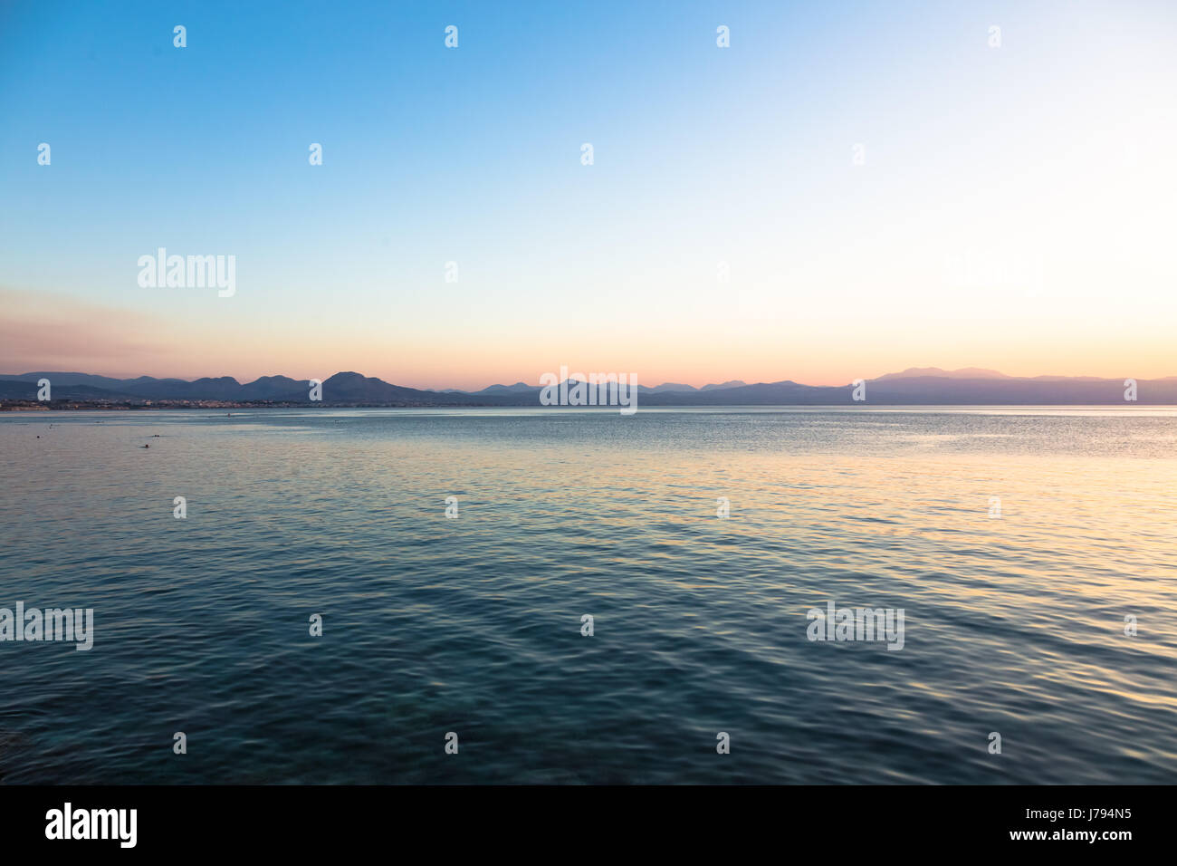 Sunset from Loutraki beach, Gulf of Corinth, Greece Stock Photo - Alamy