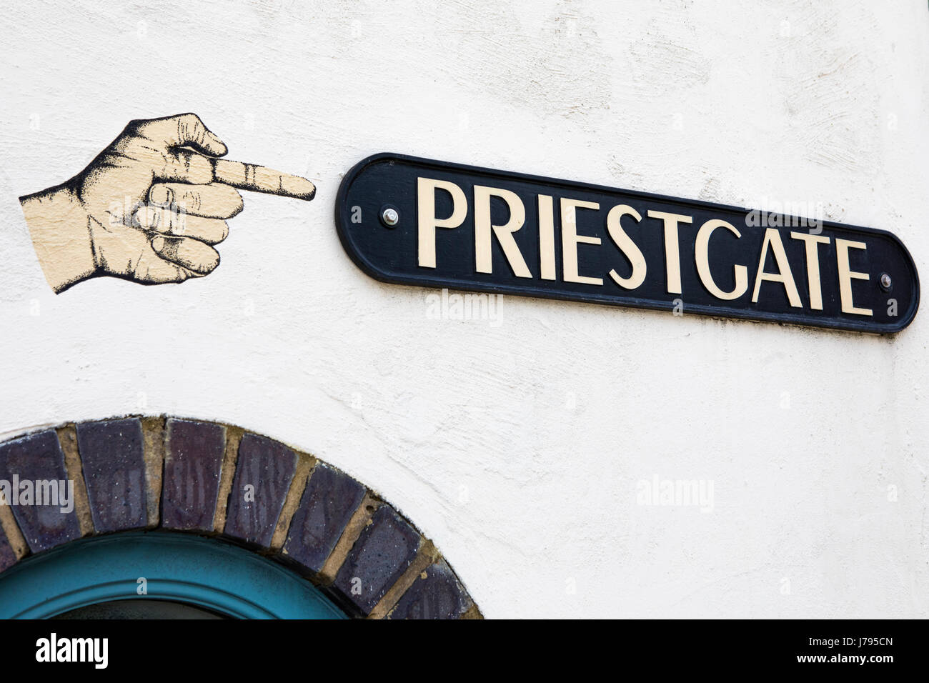 A street sign for Priestgate in the cathedral city of Peterborough in ...