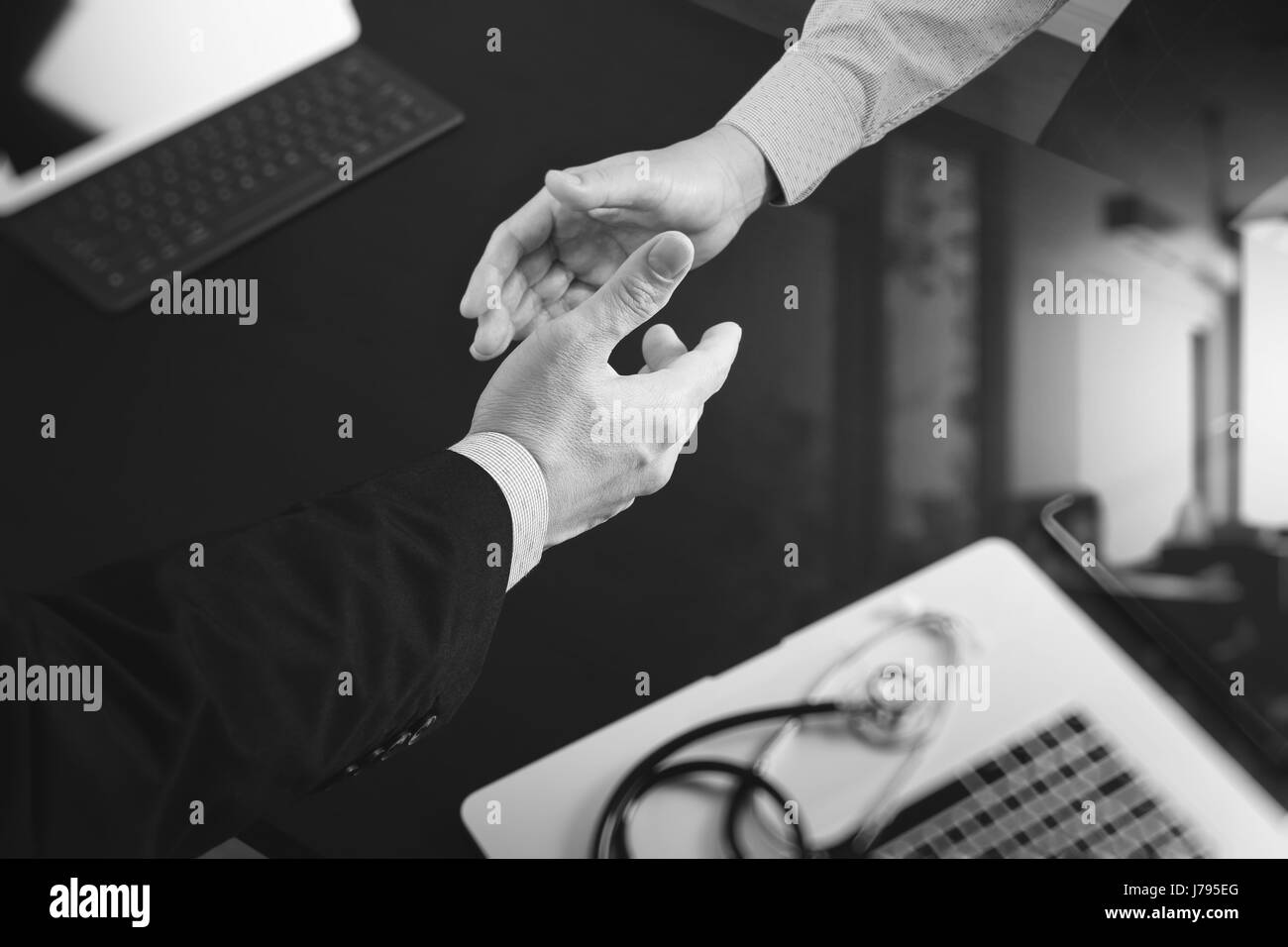 Doctor and patient handshake Black and White Stock Photos & Images - Alamy
