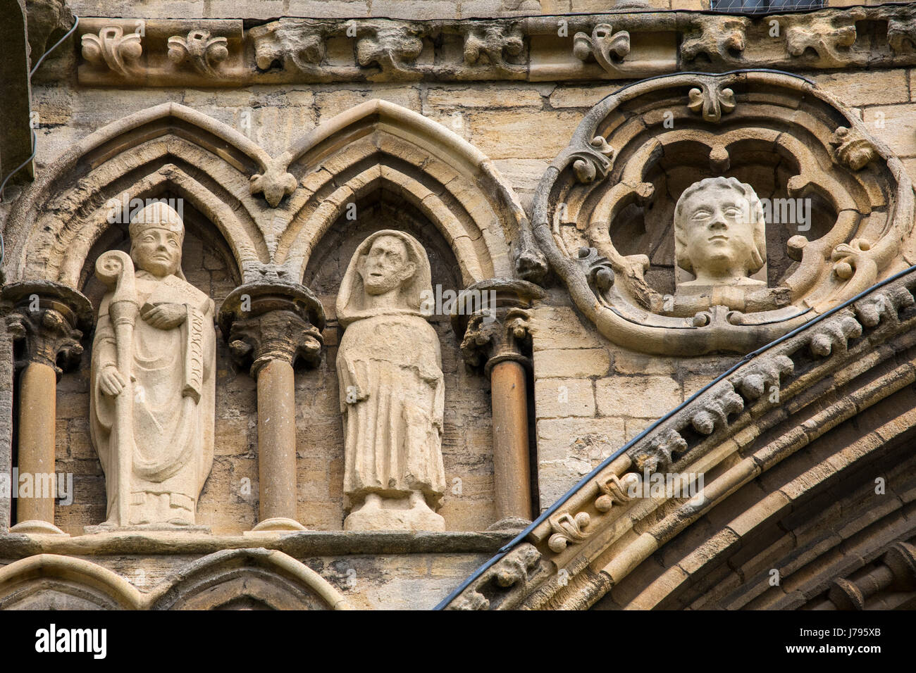Sculptures on the facade of the historic Peterborough Cathedral in ...