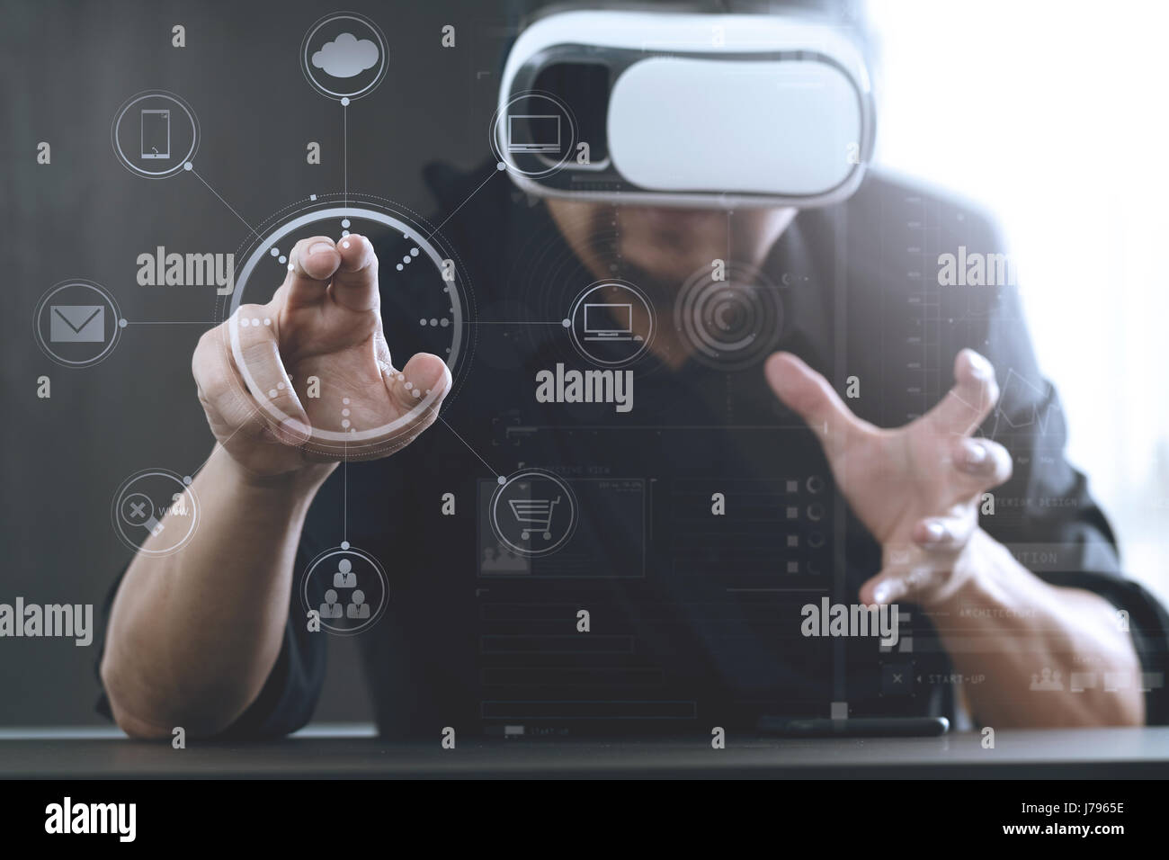 businessman wearing virtual reality goggles in modern office with ...