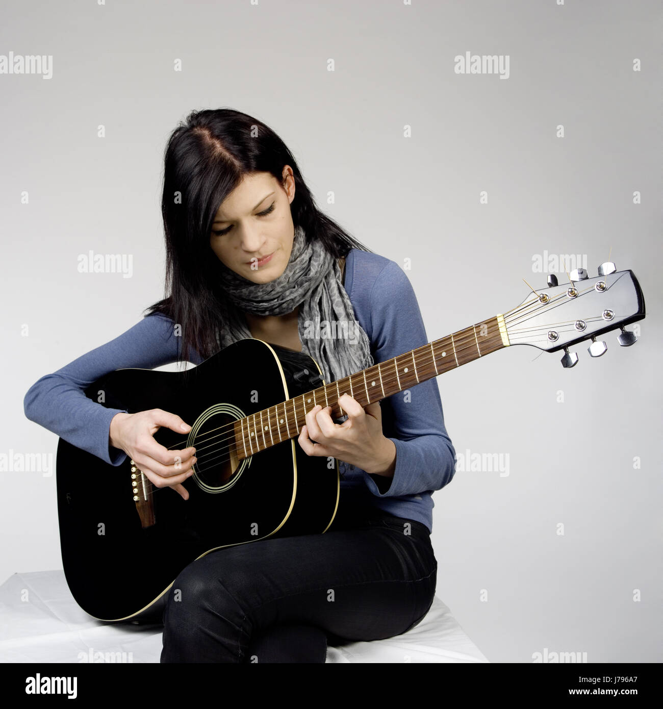 woman playing guitar Stock Photo - Alamy