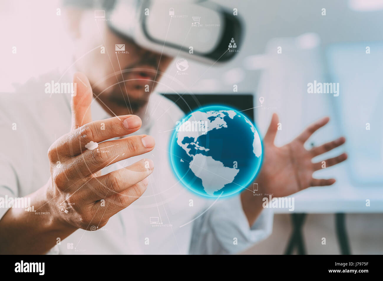 businessman wearing virtual reality goggles in modern office with ...