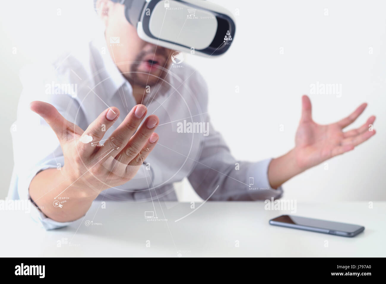 businessman wearing virtual reality goggles in modern office with ...