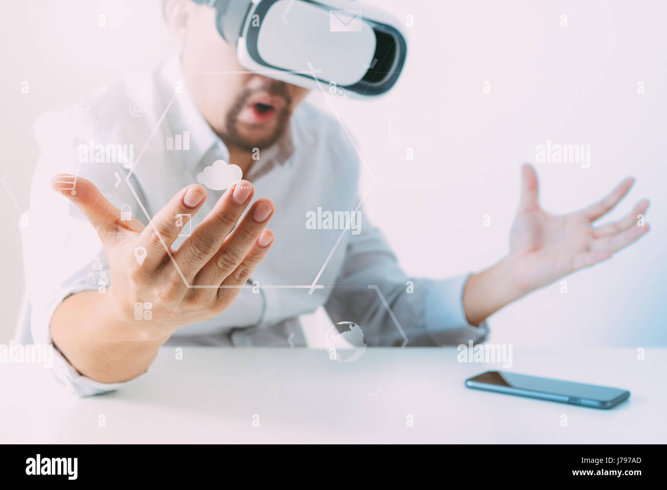 businessman wearing virtual reality goggles in modern office with ...