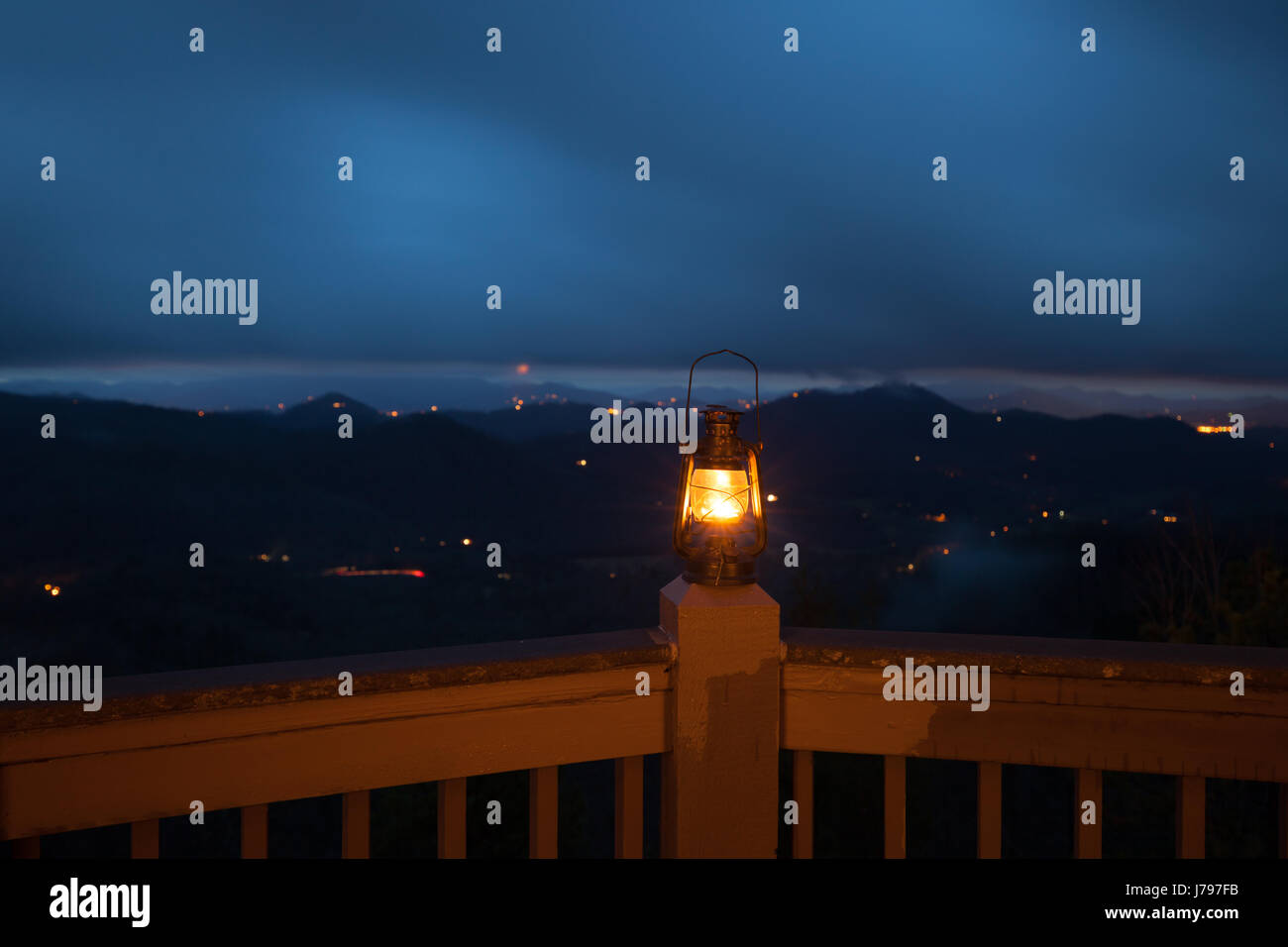 Retro style lantern over night mountain background Stock Photo - Alamy