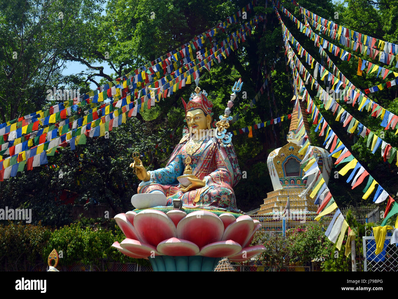 Statue and prayer flags in Swayambhu Swayambhunath Temple Stock Photo ...