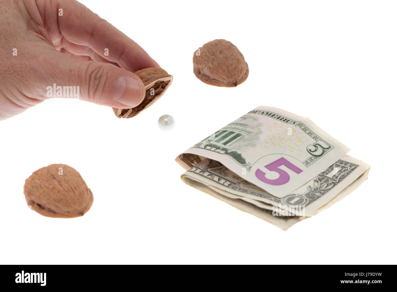 shell game with money Stock Photo - Alamy