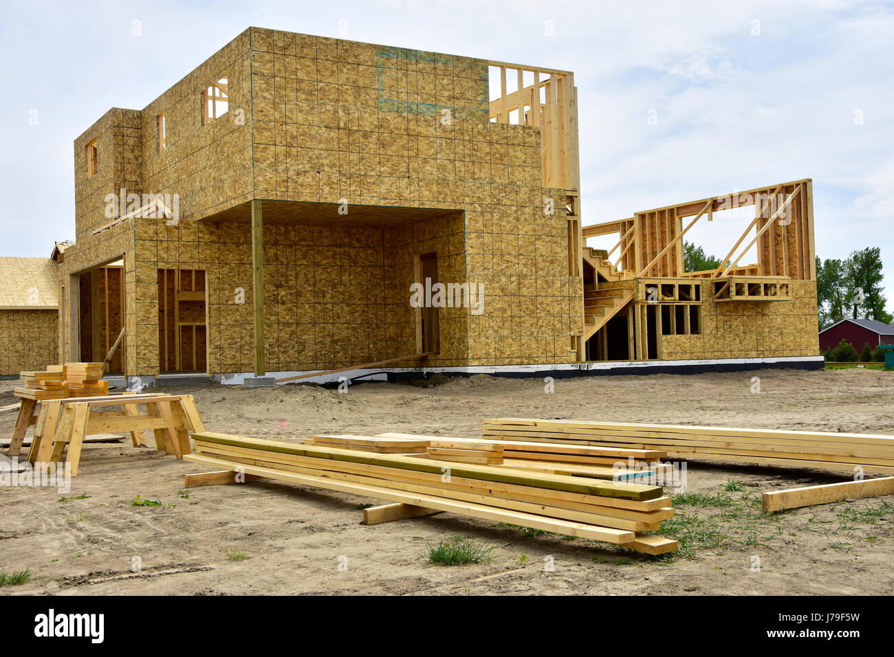 New wood frame homes under construction Stock Photo - Alamy