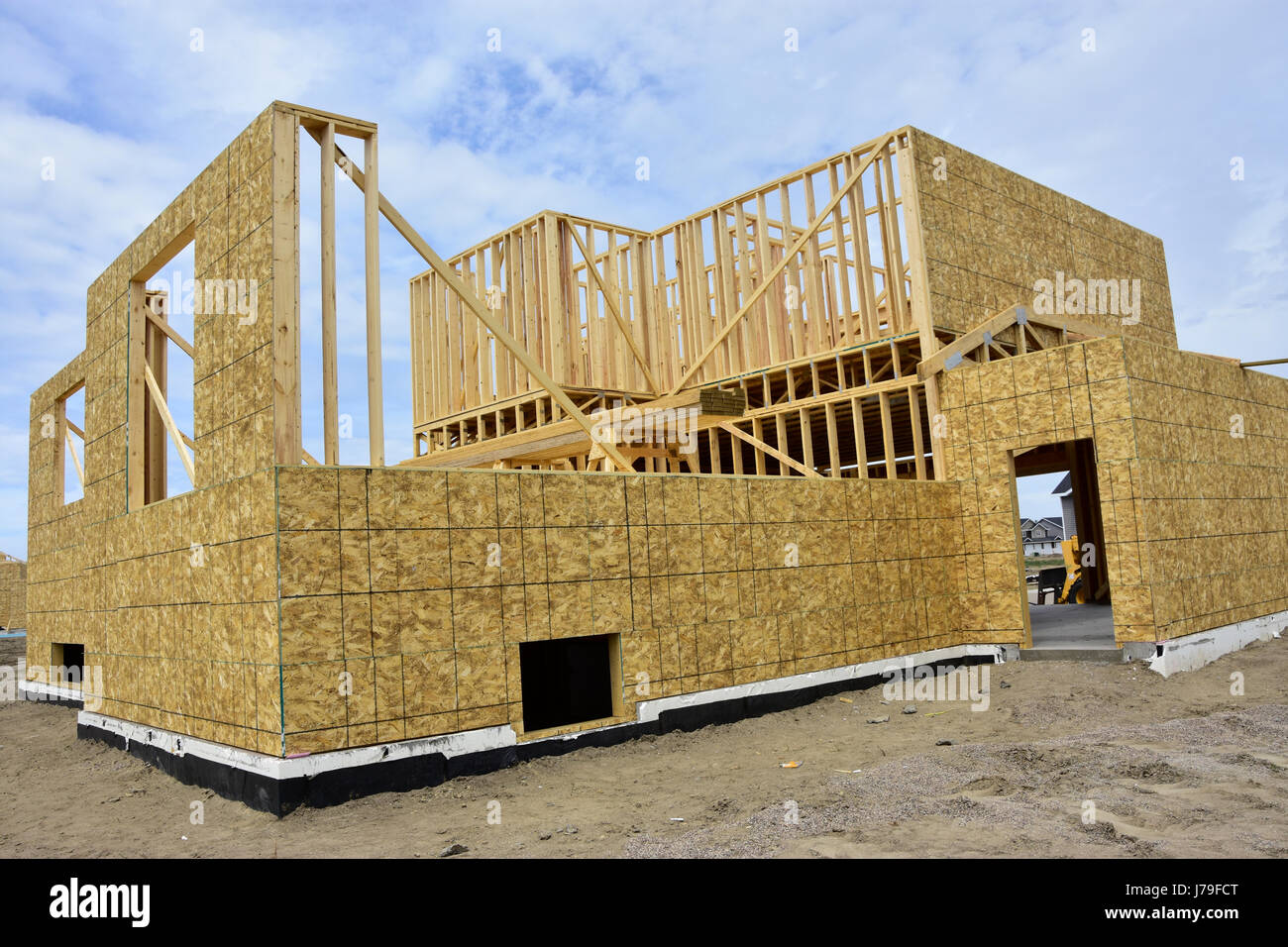 New wood frame homes under construction Stock Photo - Alamy