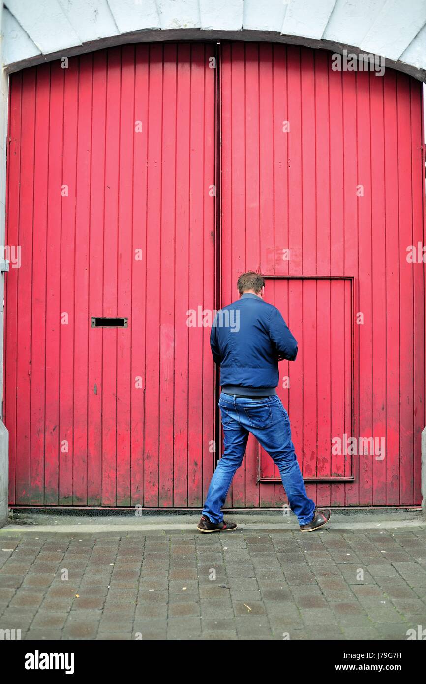 Man entering workplace via a door within a door in Limerick, County ...