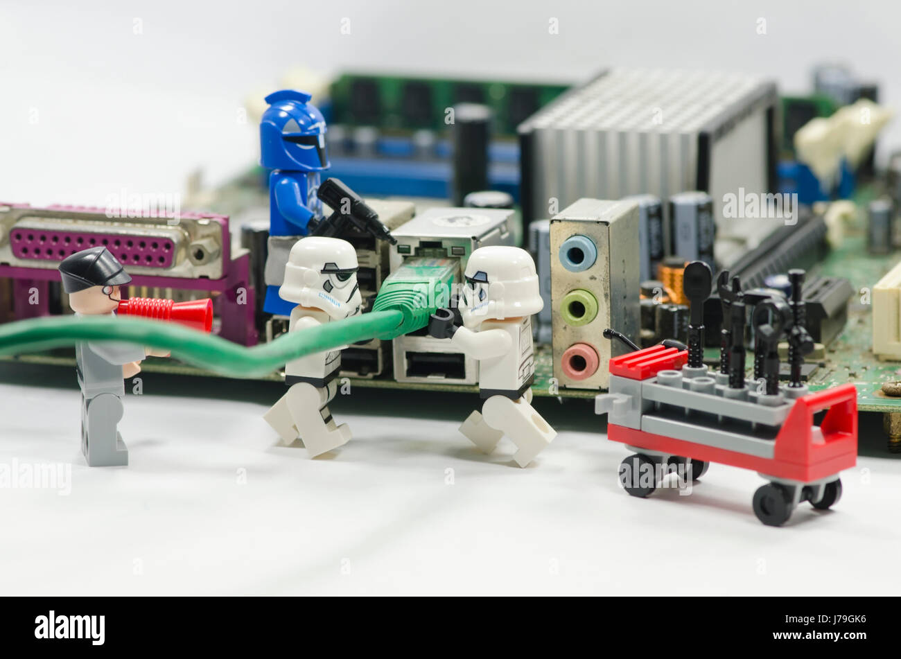 lego starwars minifigures working to plug in internet cable to the port ...