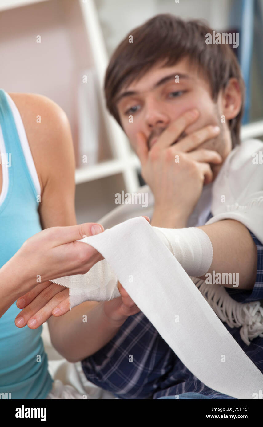 hand pain bandage injury dressing couple pair man home woman hand ...