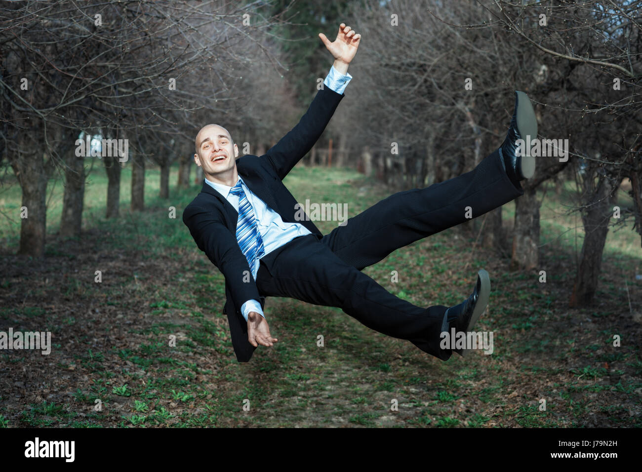Man falls in the park. The smile on his face, he is happy Stock Photo ...