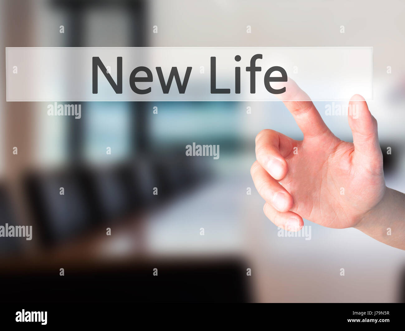 New Life - Hand pressing a button on blurred background concept ...