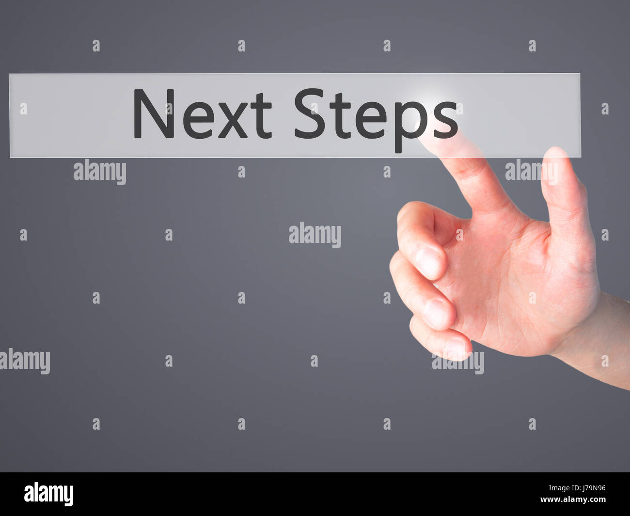 Next Steps - Hand pressing a button on blurred background concept ...