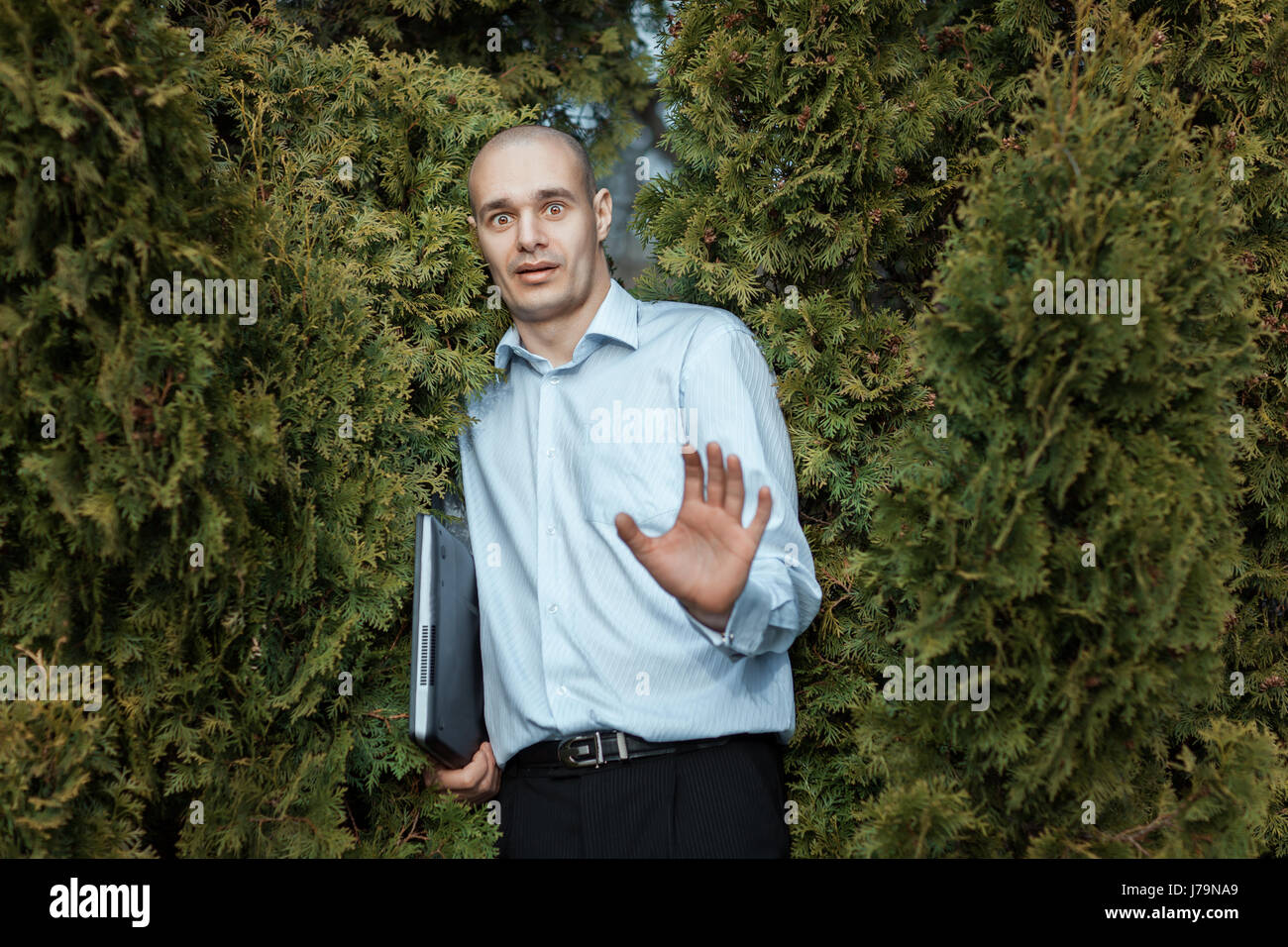 Man holding laptop under arm hi-res stock photography and images - Alamy