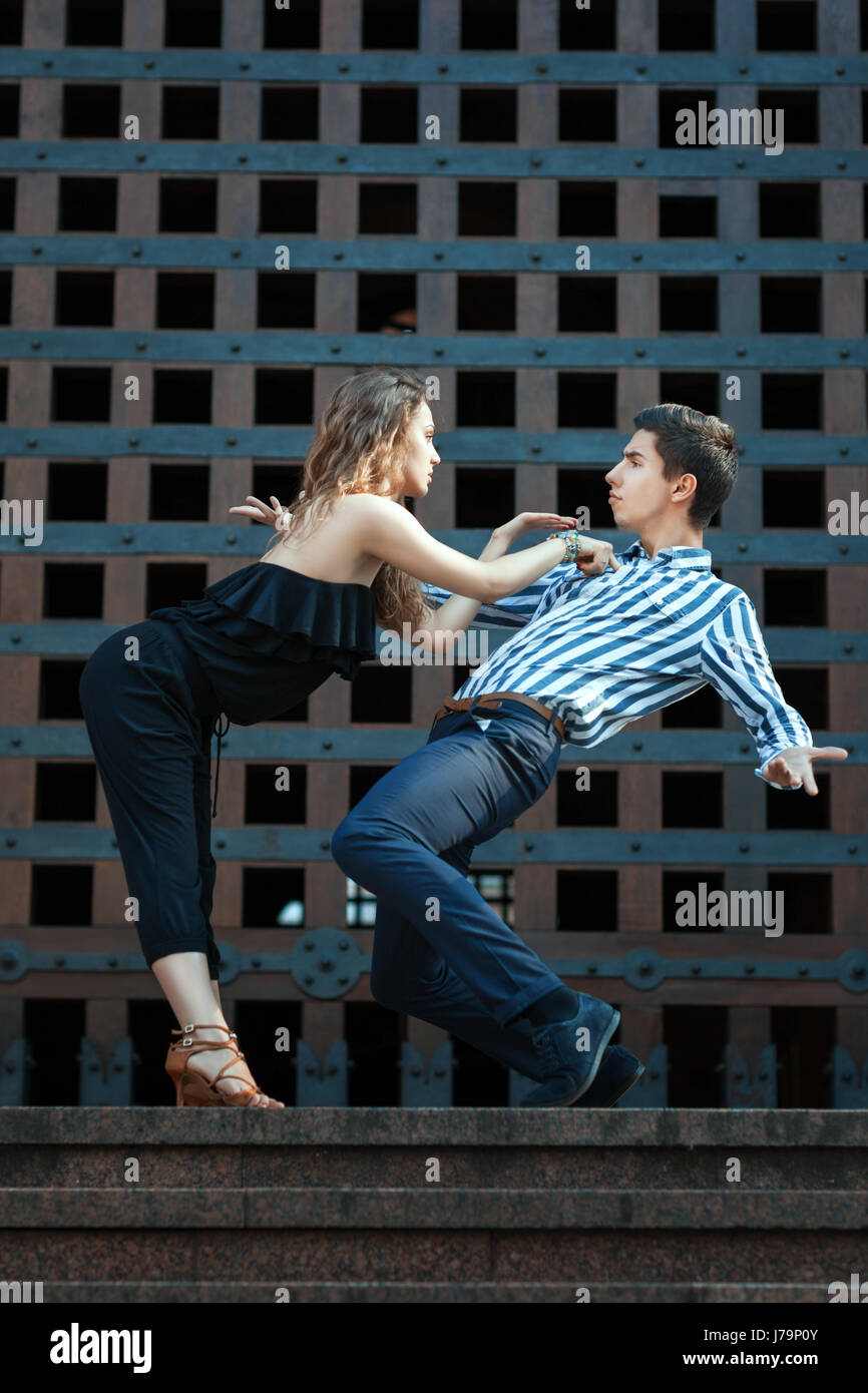 Young couple dancing the tango. They play emotions. See more photos of ...