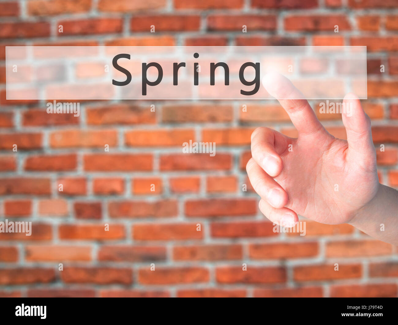 Spring - Hand pressing a button on blurred background concept ...
