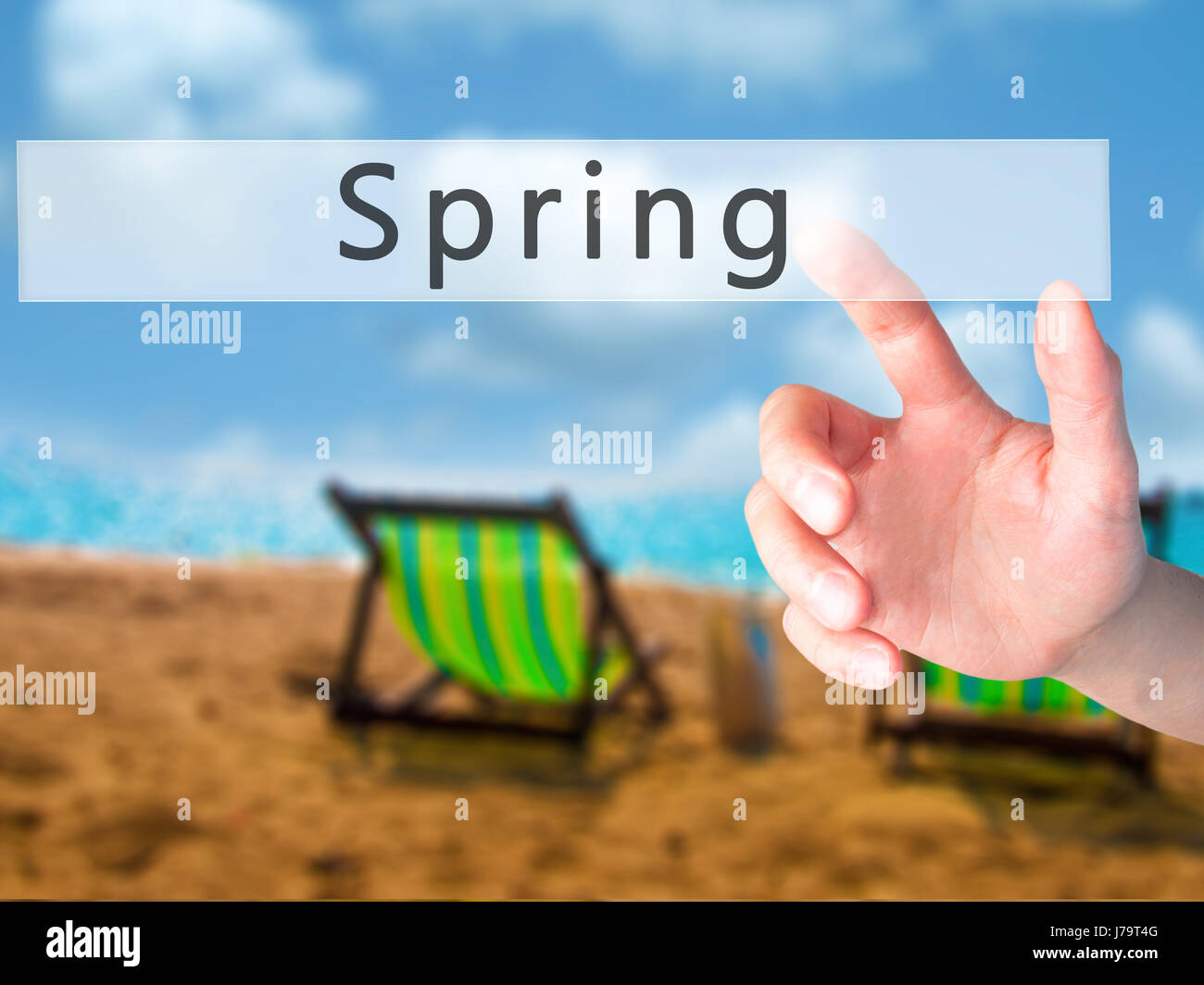 Spring - Hand pressing a button on blurred background concept ...