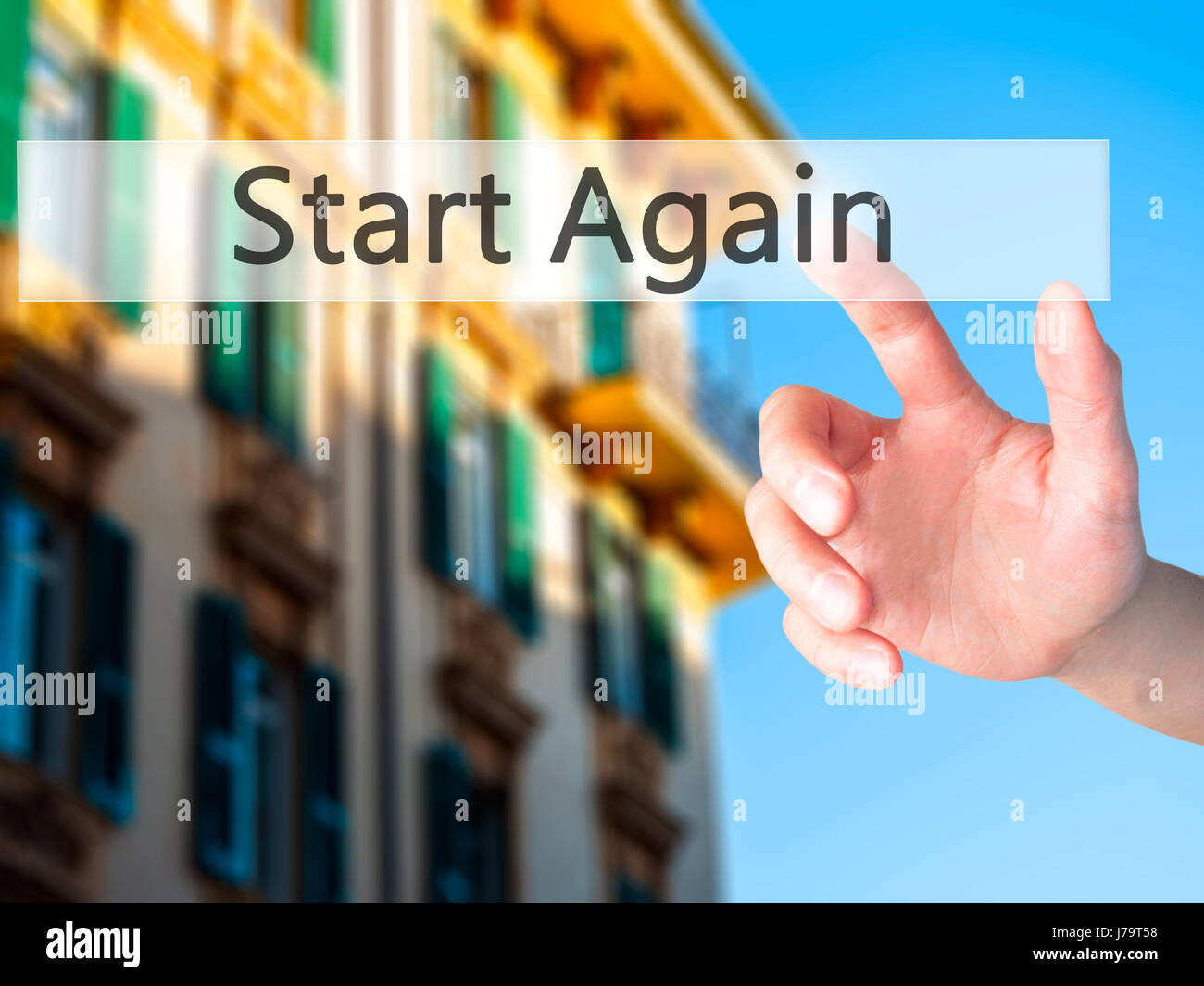 Start Again - Hand pressing a button on blurred background concept ...
