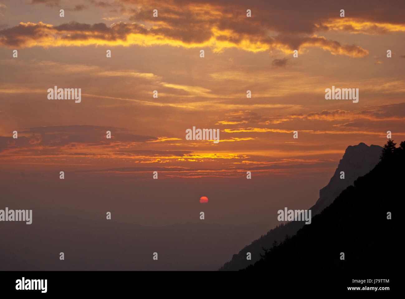 Early morning in the Styrian limestone Alps. The clouds are brightly ...
