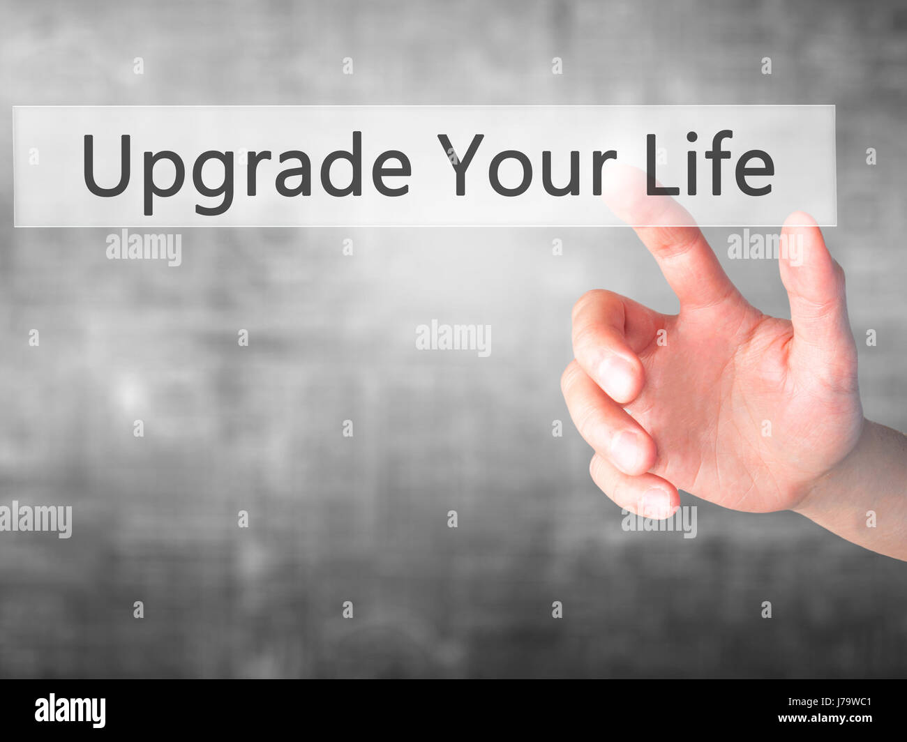 Upgrade Your Life - Hand pressing a button on blurred background ...