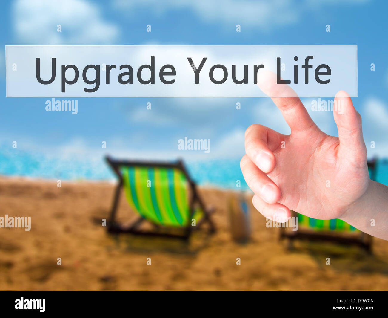 Upgrade Your Life - Hand pressing a button on blurred background ...