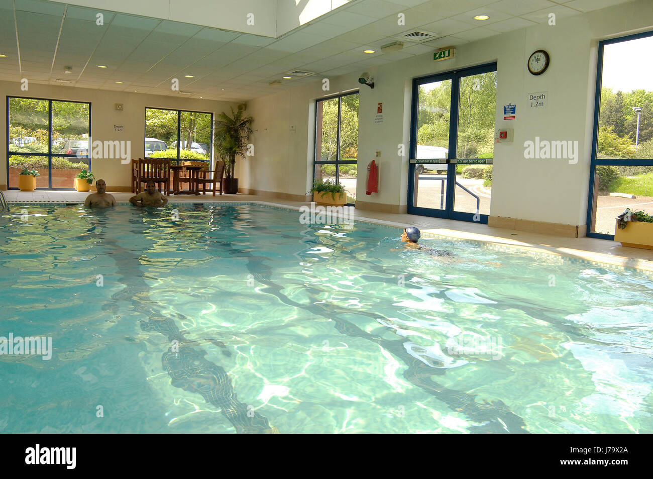 Sports club swimming pool with sunlight reflecting off the water Stock ...