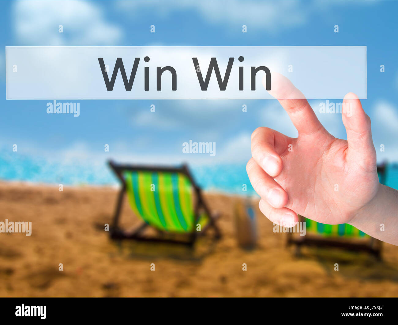 Win Win - Hand pressing a button on blurred background concept ...