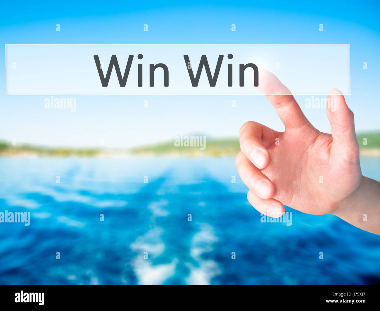 Win Win - Hand pressing a button on blurred background concept ...