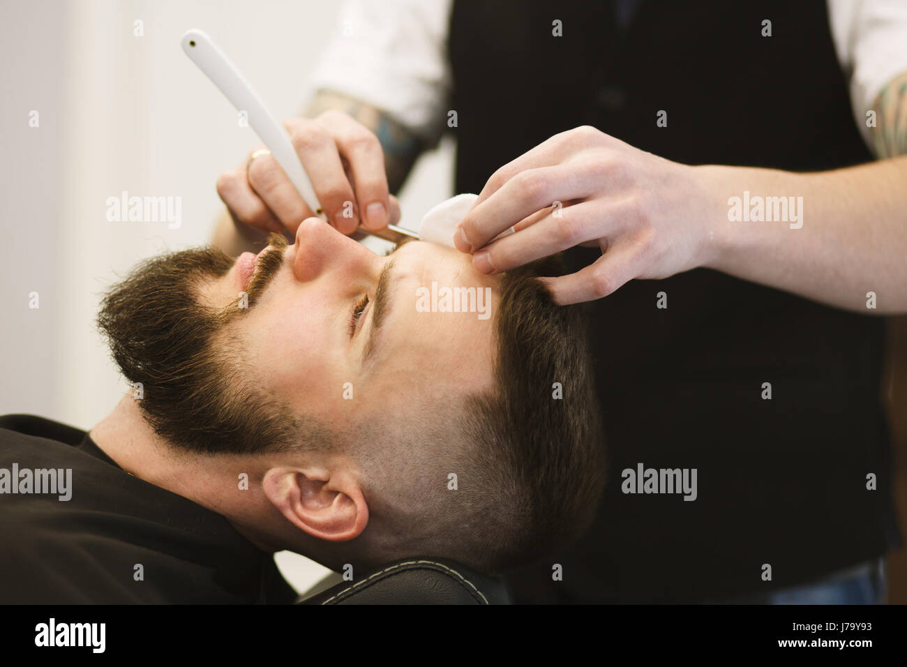 Professional barber doing a haircut Stock Photo - Alamy
