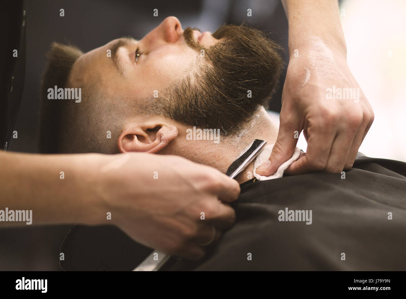 Professional barber doing a haircut Stock Photo - Alamy
