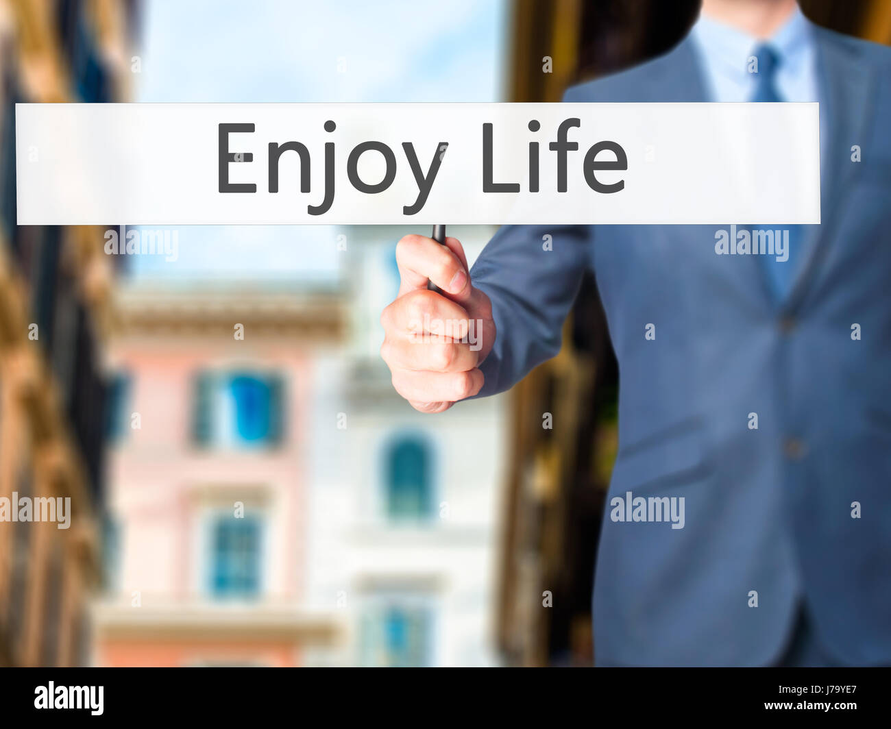 Enjoy Life - Businessman hand holding sign. Business, technology ...