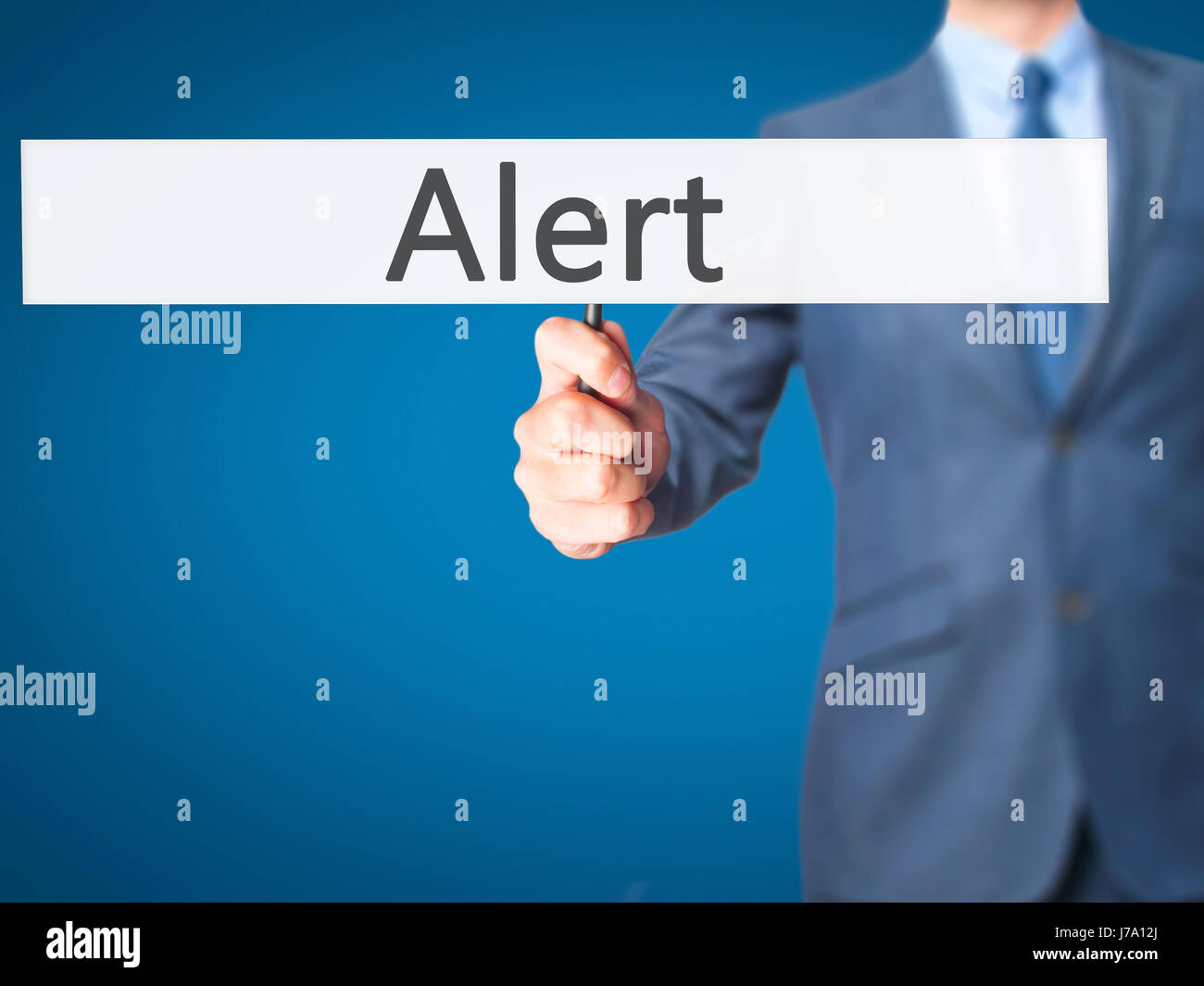 Alert - Businessman hand holding sign. Business, technology, internet ...