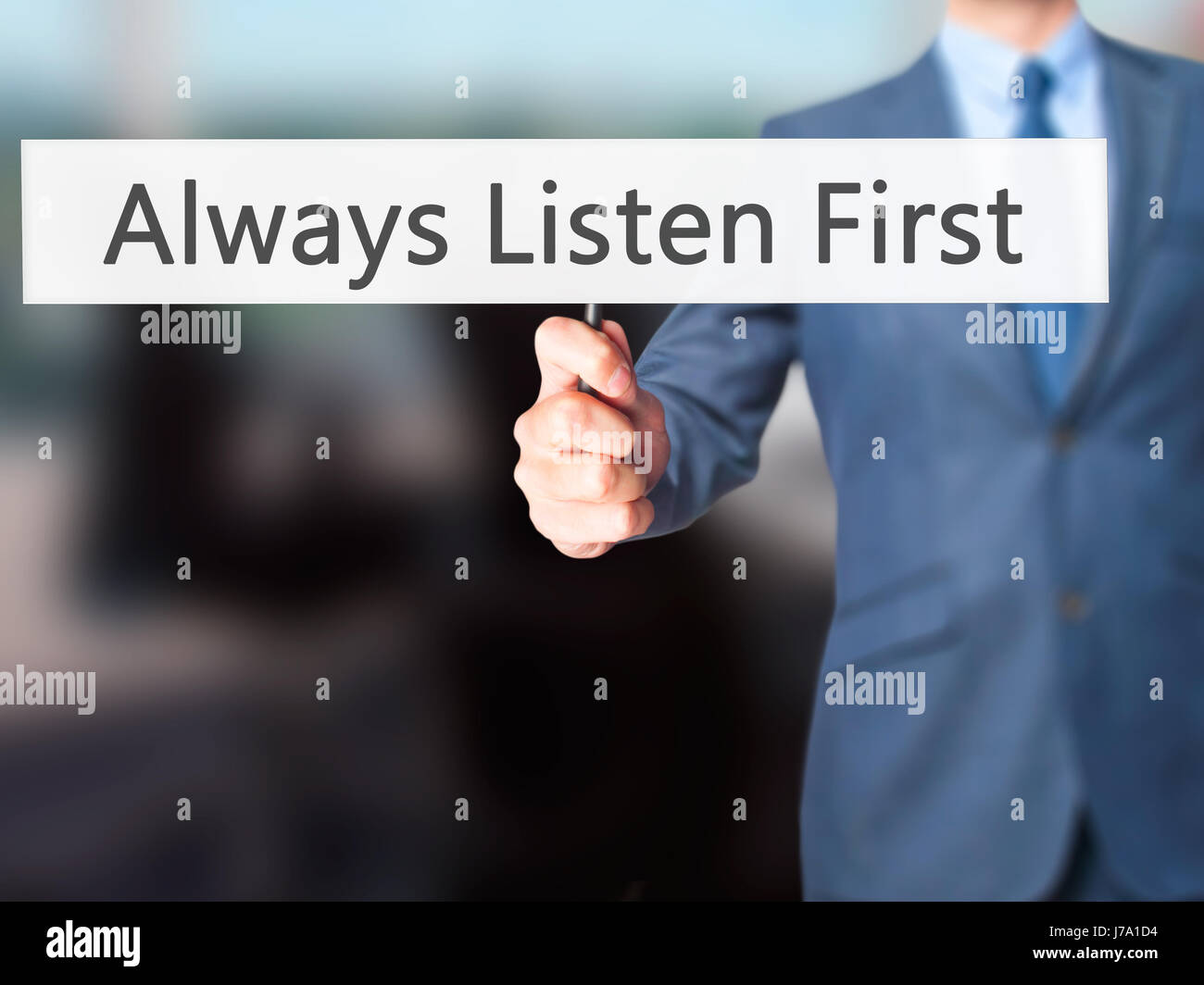 Always Listen First - Businessman hand holding sign. Business ...