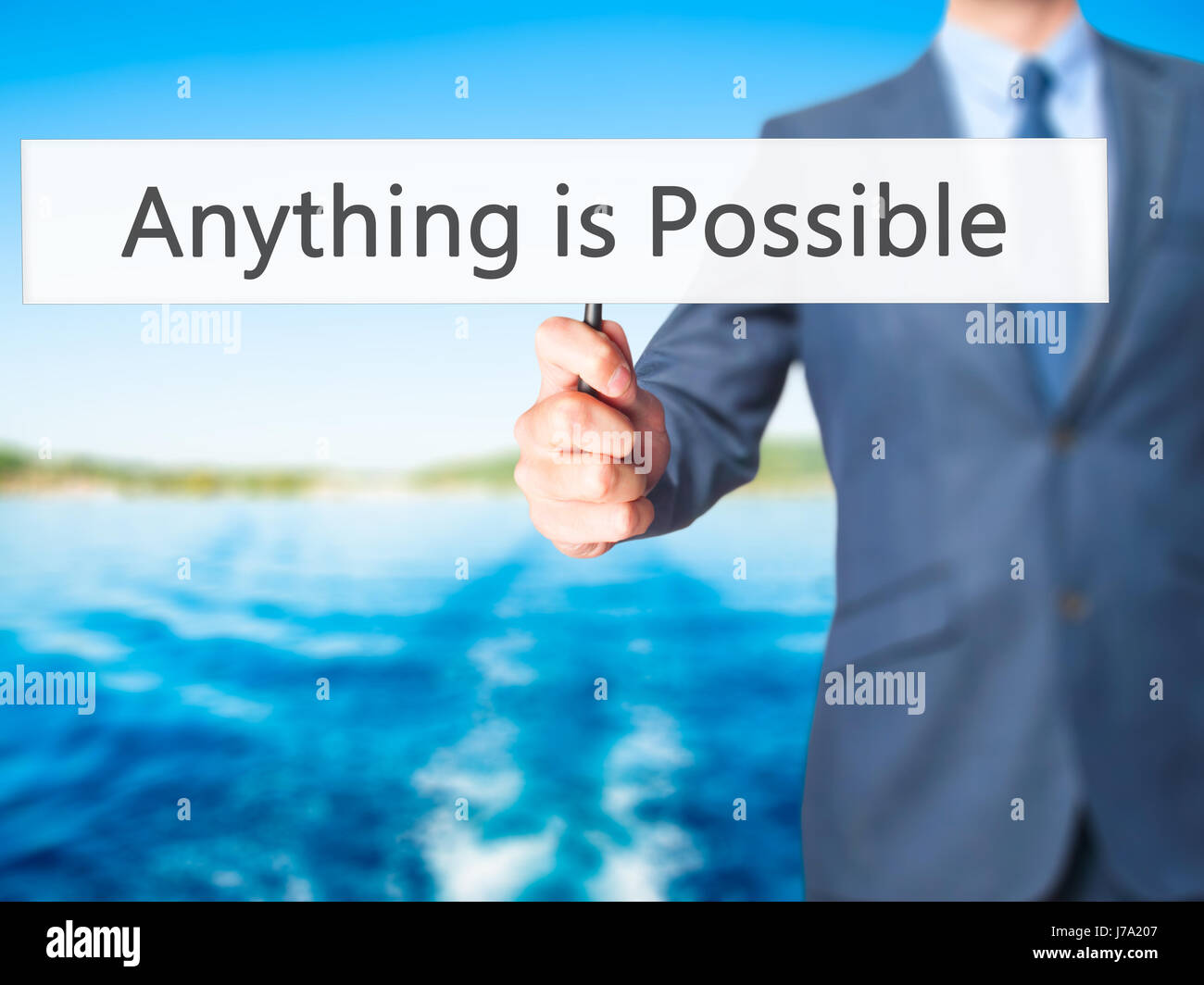 Anything is Possible - Businessman hand holding sign. Business ...