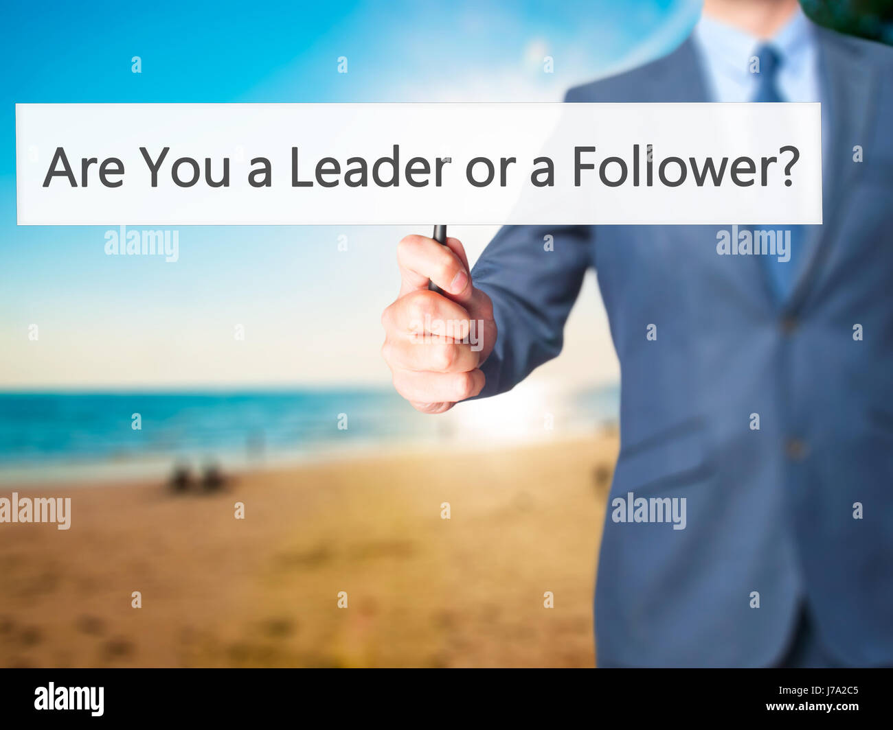 Are You a Leader or a Follower ? - Business man showing sign. Business ...