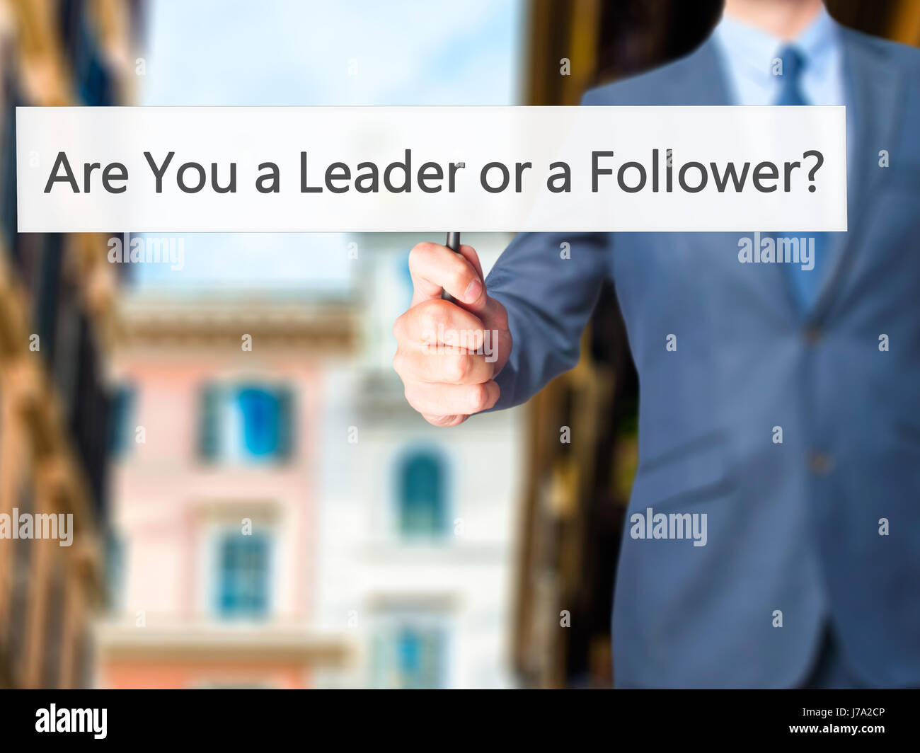 Are You a Leader or a Follower ? - Business man showing sign. Business ...