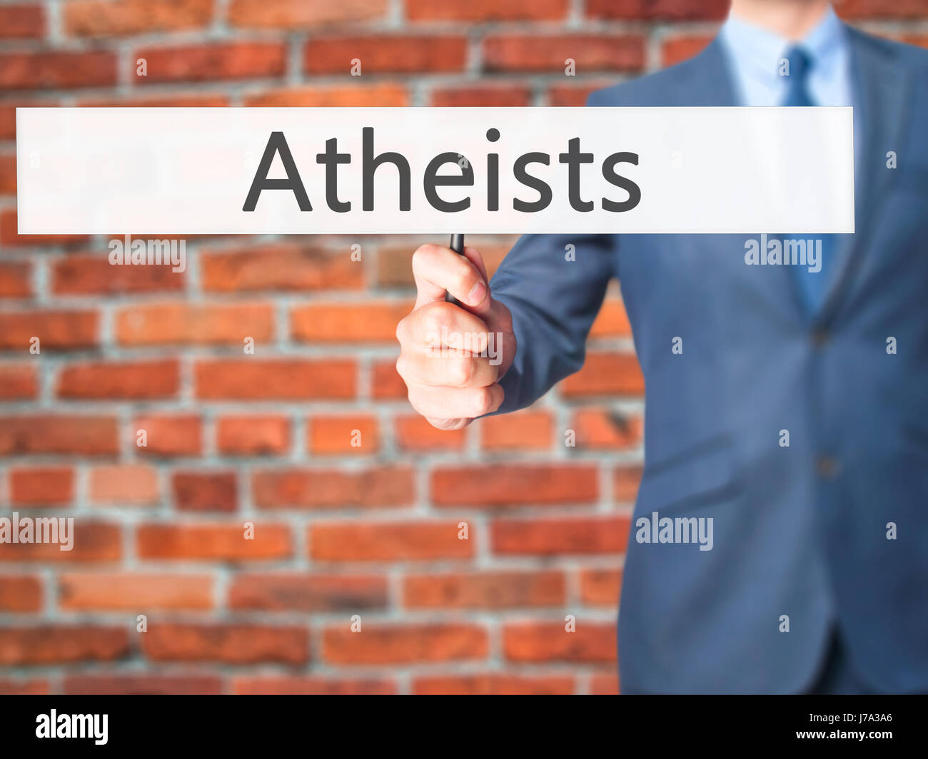 Atheists - Businessman hand holding sign. Business, technology ...